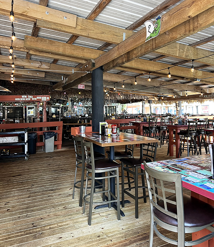 Wooden beams, string lights, and the promise of cold beer. The outdoor dining area feels like your luckiest friend's back porch.