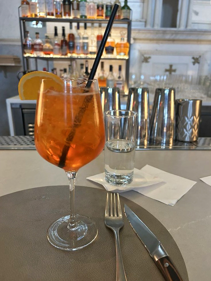 An Aperol Spritz that glows like a Maryland sunset, offering the perfect balance of bitter, sweet, and bubbly&mdash;just like the best conversations.