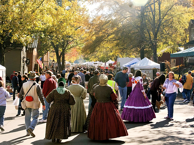 Festival crowds in period dress create a living tableau that brings the village's vibrant past to life.