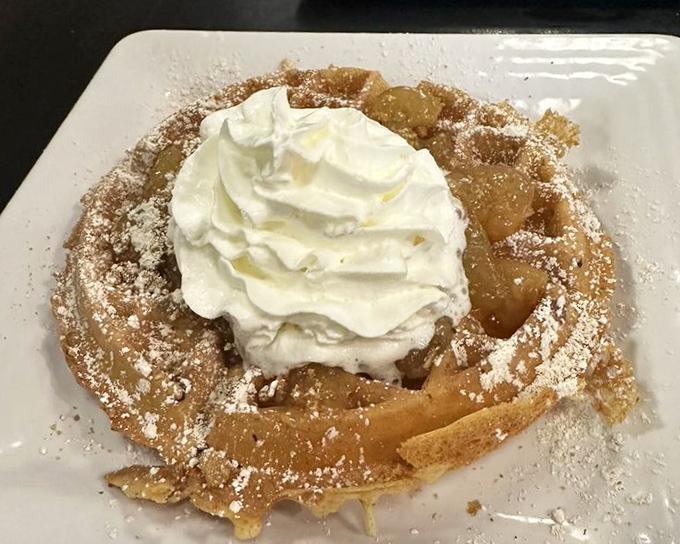 This apple-topped waffle with whipped cream isn't just breakfast&mdash;it's what happens when dessert wakes up early and crashes the morning party.