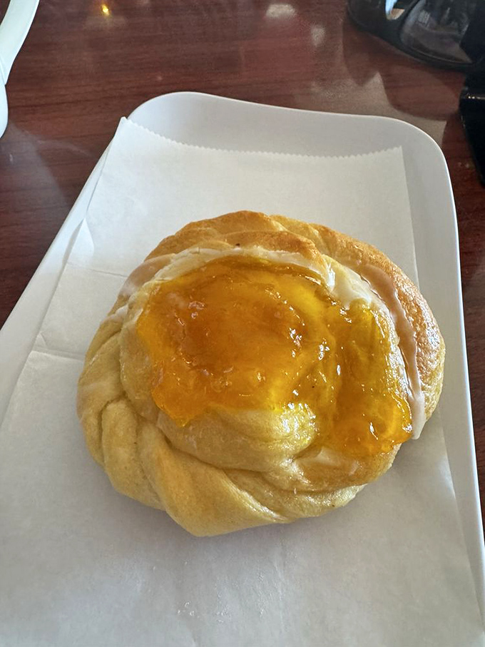 This apricot danish isn't just breakfast&mdash;it's edible sunshine. The glaze catches light like it's auditioning for a pastry calendar.