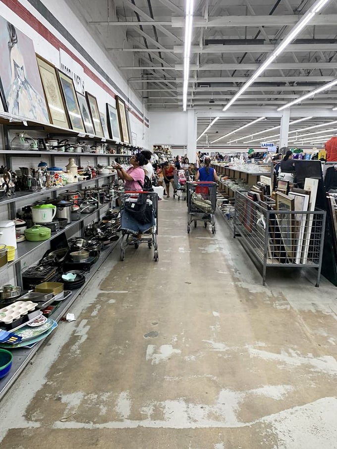 The housewares aisle offers everything from practical pots to questionable wall art. Someone's "finally time to declutter" becomes your "perfect find."