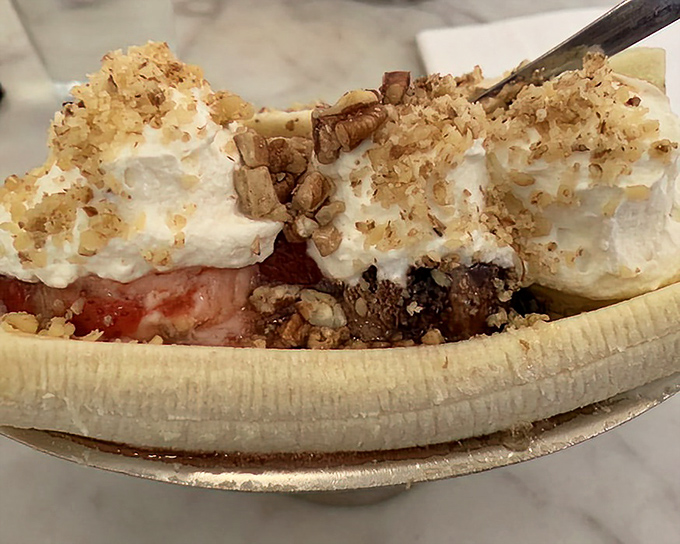 This banana split isn't just dessert&mdash;it's a work of art. Whipped cream mountains with nutty avalanches sliding into fruity valleys.