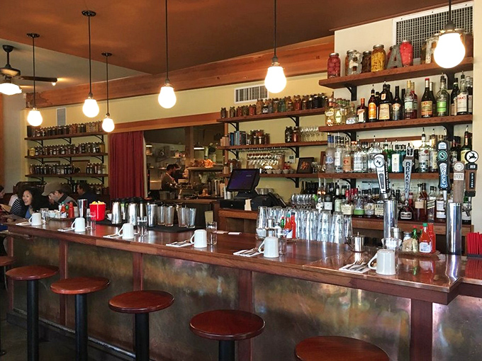 A well-stocked bar is the backbone of any great restaurant. This one's ready for whatever your taste buds desire.