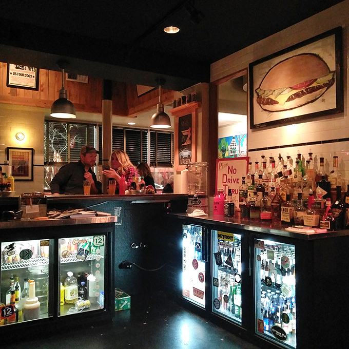 The bar isn't just where drinks are made&mdash;it's command central for Mercury's liquid happiness operations, complete with vintage burger artwork.