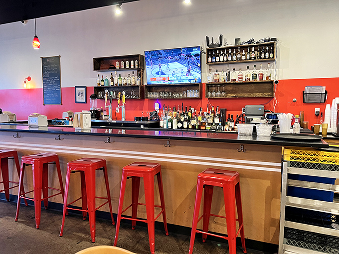 Even the bar area maintains that laid-back coastal vibe that makes everyone feel like regulars.