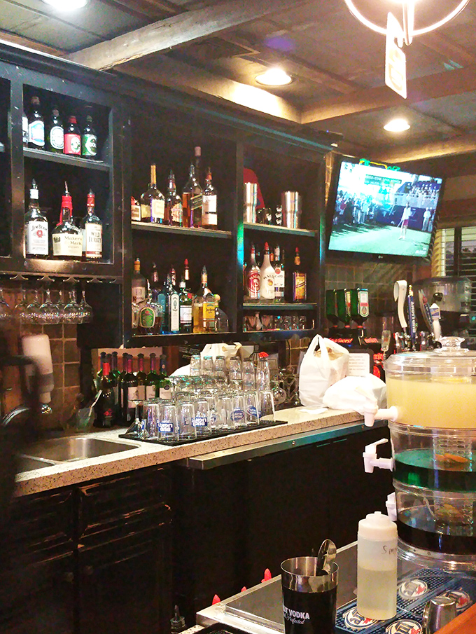 The bar stands ready to quench coastal thirsts. A well-stocked selection ensures your seafood feast has the perfect liquid accompaniment.