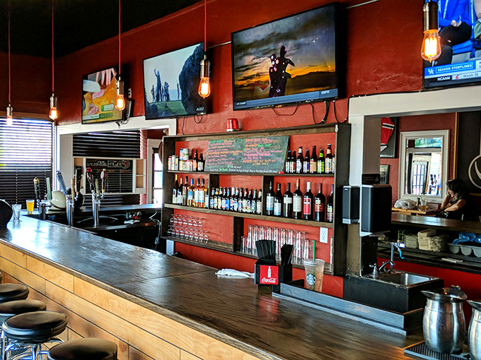 Behind this bar, liquid happiness flows while TVs ensure you never miss a play, even during that critical first bite.