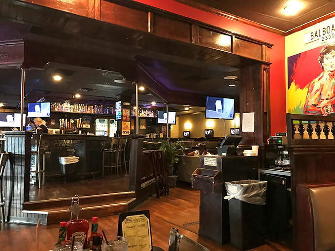 The bar area buzzes with energy as locals gather to catch the game, share stories, and enjoy drinks with some of the best happy hour deals in town.