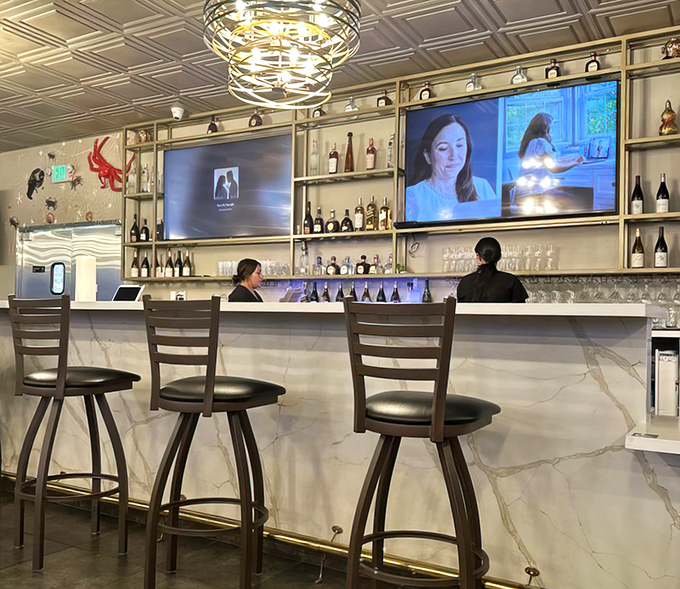 The elegant bar area proves seafood boils can coexist with cocktail sophistication. Best of both worlds.