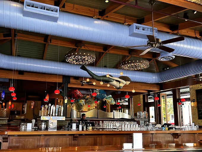 The bar where maritime meets mixology &ndash; those hanging fish sculptures seem to approve of your cocktail choice.