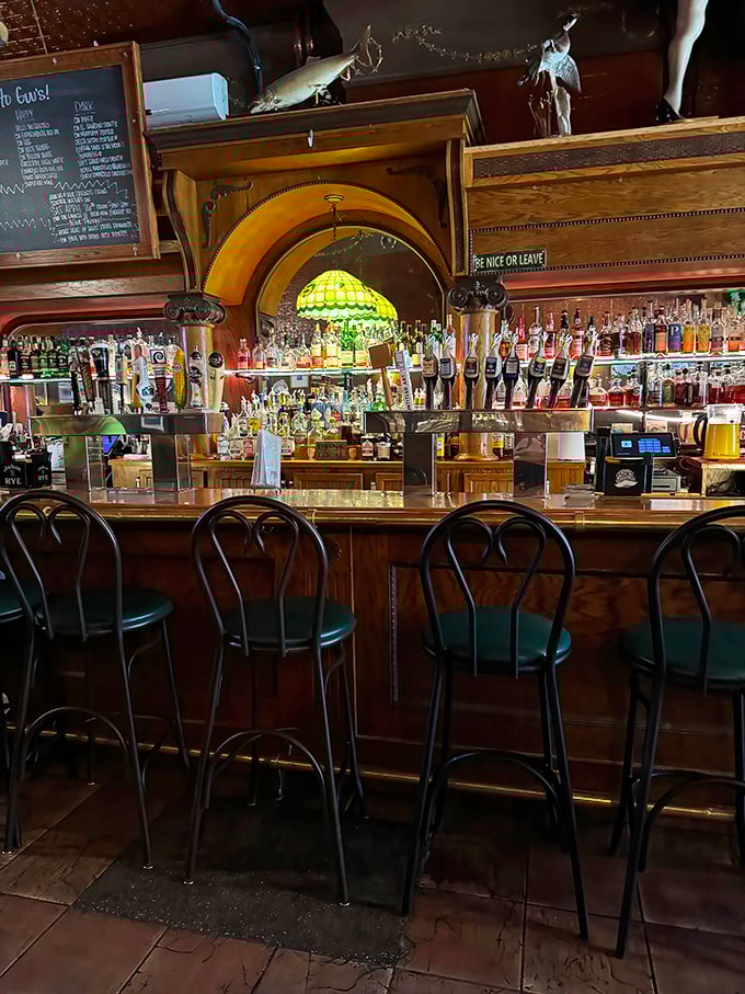 Behind this bar lies liquid happiness in many forms, illuminated by the warm glow of a Tiffany-style lamp that's seen decades of celebrations.