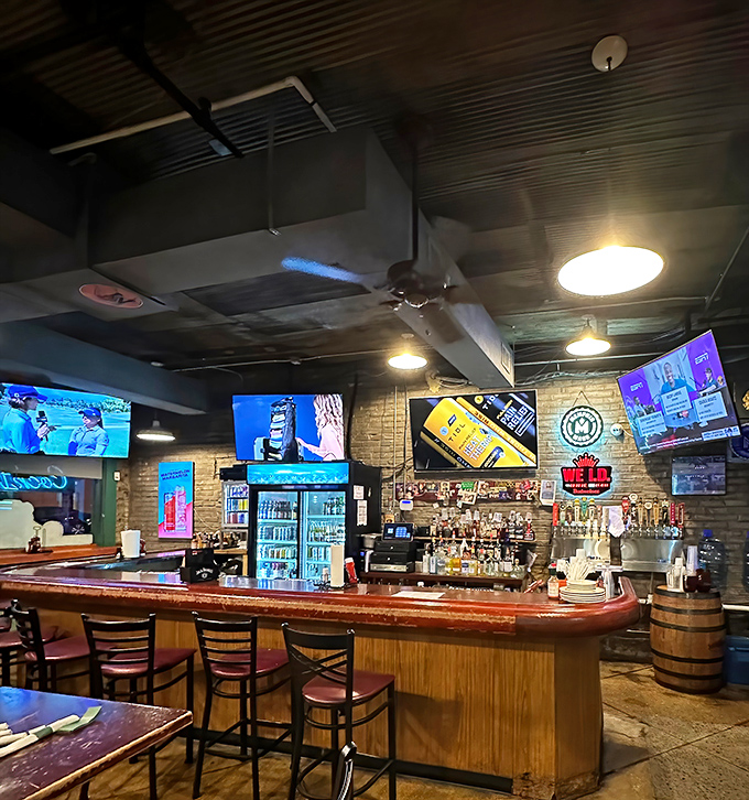 The bar area hums with anticipation&mdash;each bottle a potential ingredient in your perfect Memphis evening.