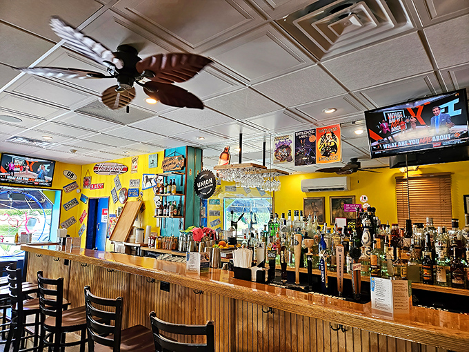 The well-stocked bar with its tropical ceiling fan says, "Yes, we're serious about drinks too." Those bottles aren't just for show.