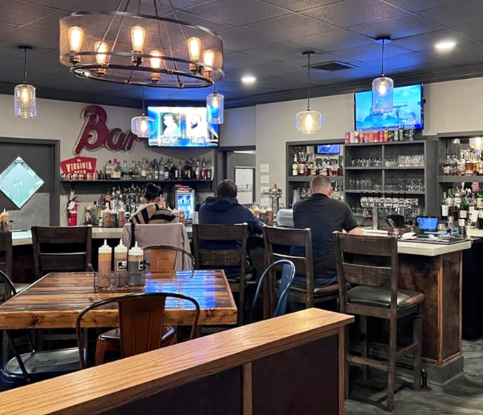 The bar area: where bourbon meets barbecue in holy matrimony. Those bar stools have supported the weight of many happy, sauce-stained customers contemplating a second round.