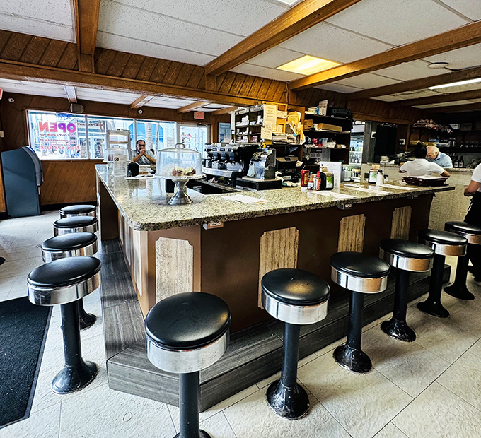 At this counter, coffee machines hiss like jazz musicians and granite tops gleam under lights that have witnessed countless cafecito-fueled conversations.