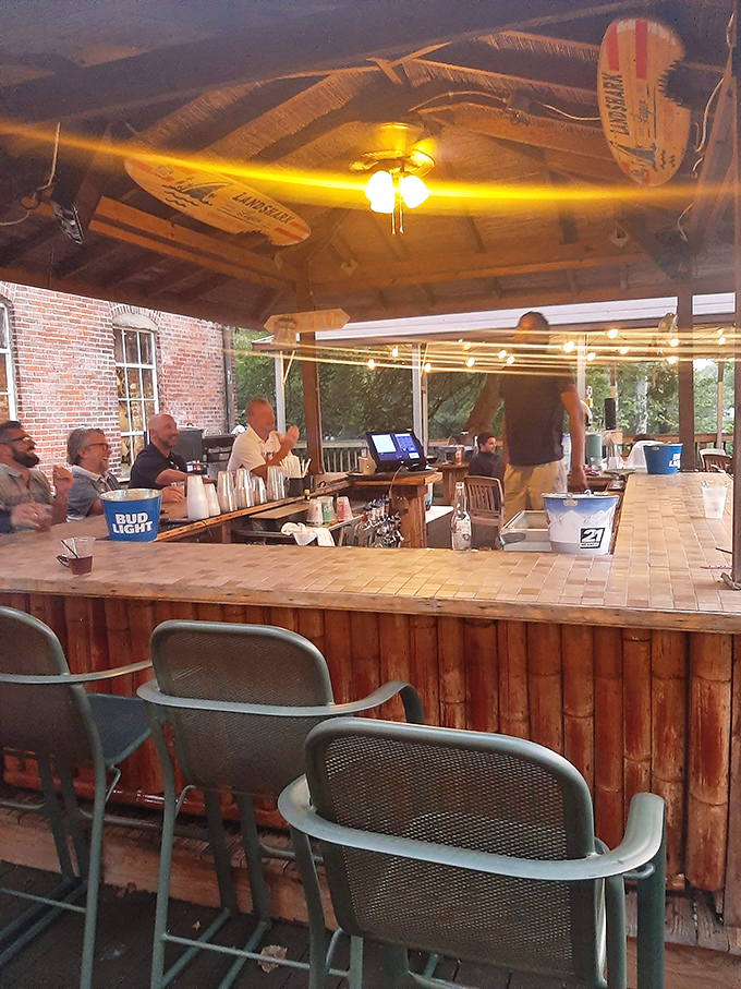 A bar that understands its mission: provide liquid courage and conversation starters in equal measure. The wooden stools have heard it all.