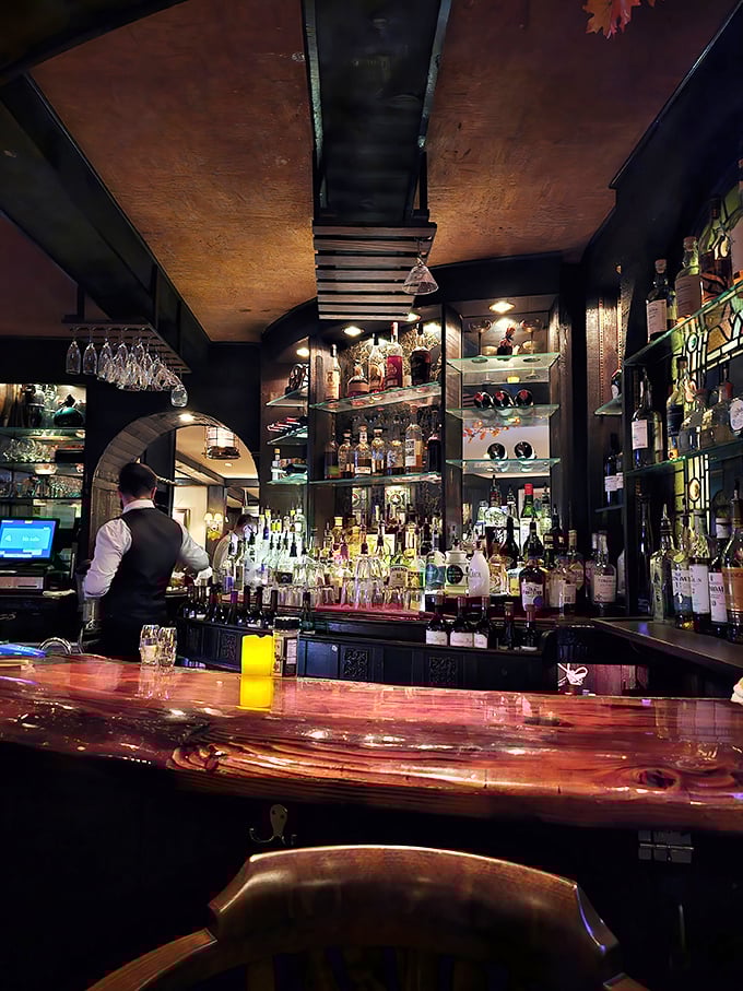 Behind every great restaurant is a bar that could tell stories. This one, with its gleaming bottles and warm wood, has heard them all.