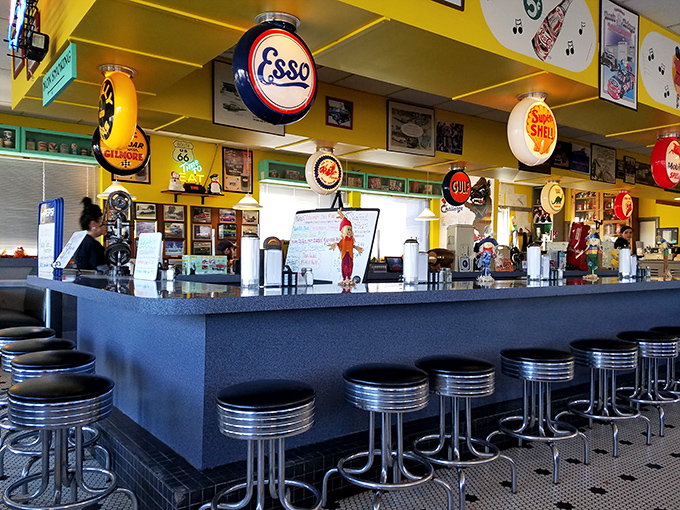 The counter where strangers become neighbors and regulars become family, all connected by the universal language of "pass the ketchup, please."