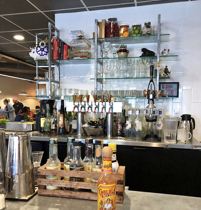 Behind every great breakfast is a bar setup worthy of admiration. Those glass shelves hold liquid possibilities for elevating your morning.