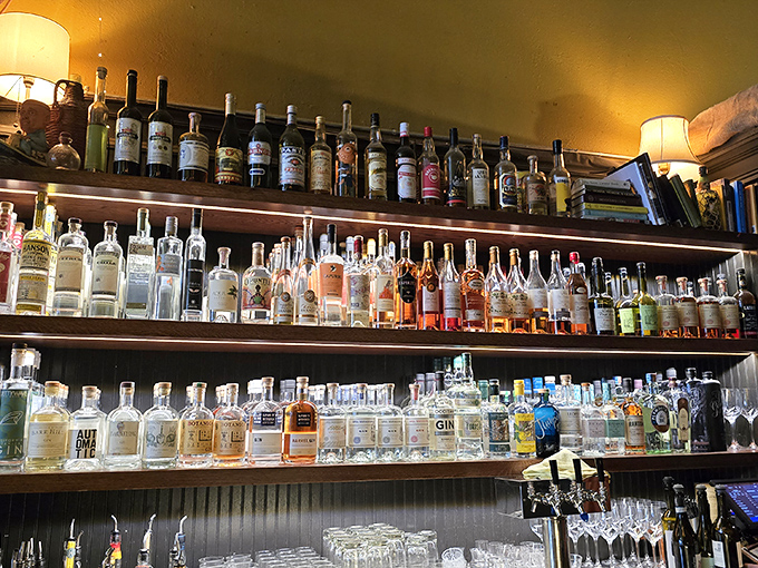The bar showcases an impressive collection that would make any spirits enthusiast weep tears. 