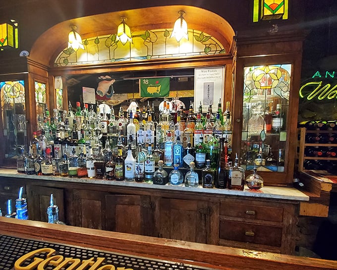 Behind this bar, bottles aren't just inventory &ndash; they're possibilities. The stained glass backdrop elevates your old fashioned from drink to experience.
