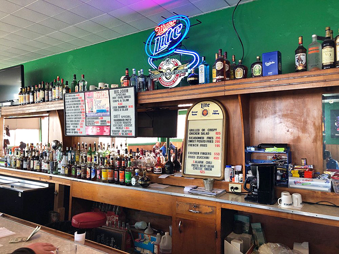 The bar area&mdash;where stories flow as freely as the drinks. That Miller Lite sign has witnessed decades of celebrations and consolations.