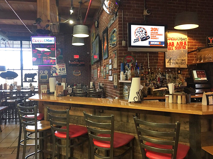 The bar area serves up liquid courage for those about to face the meat sweats. Brick walls have witnessed countless barbecue epiphanies.