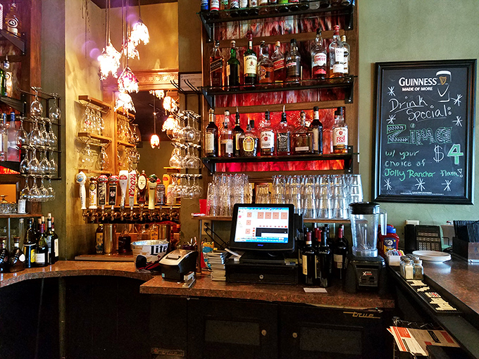 A bar stocked with enough liquid courage to help you order that second dessert. The bottles stand at attention, ready for racing season's thirsty pilgrims.