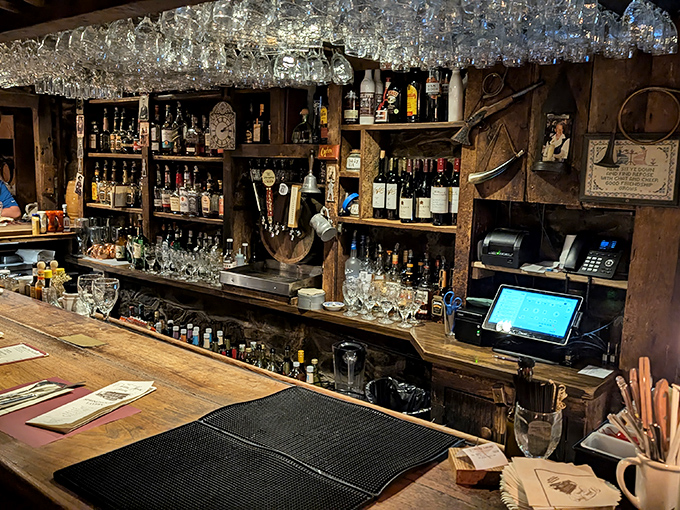 Behind this rustic bar, history and hospitality flow as freely as the spirits. The modern cash register is the only hint we're not in 1776.
