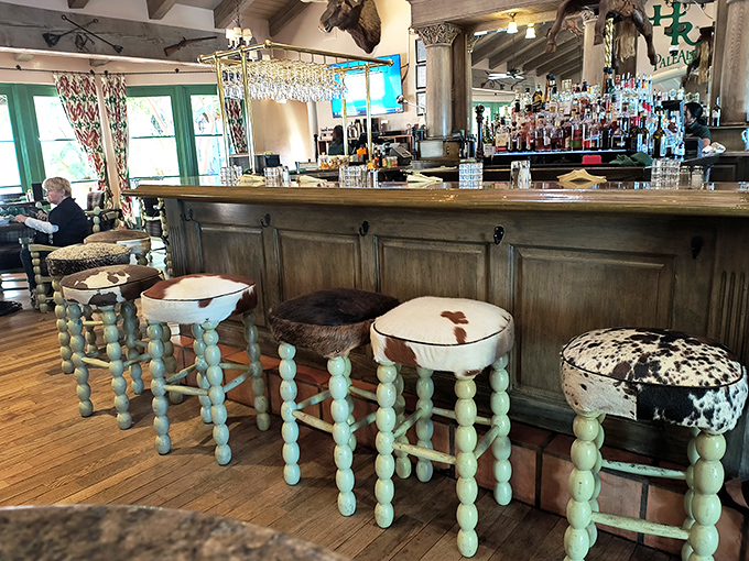 Bar stools upholstered in cowhide—a cheeky reminder of what's on the menu. The distressed wood bar has heard thousands of "I'll have another" requests.