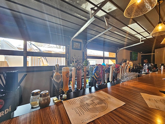 A bar that means business, with taps standing at attention like soldiers ready to serve. The wooden bartop has heard every fish tale ever told.