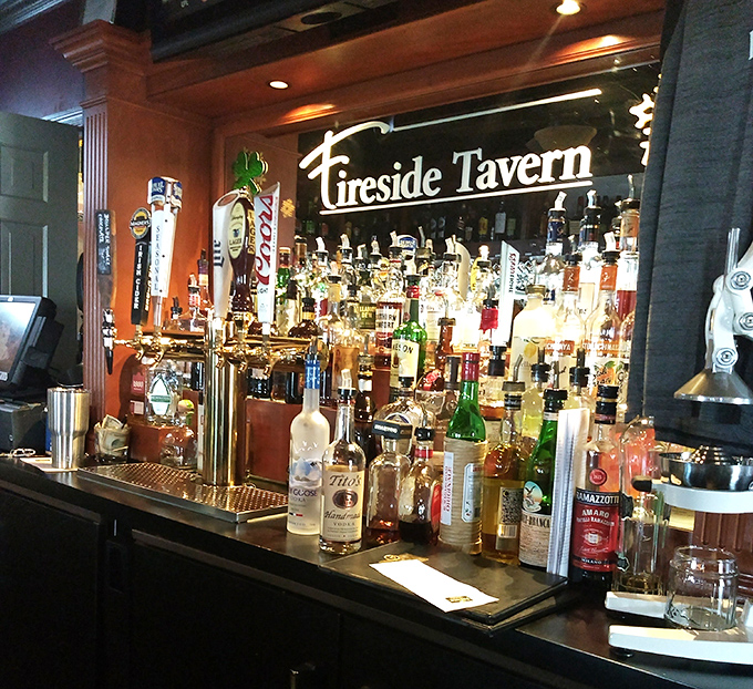 A bar stocked like a liquid library, with enough options to write your own adventure. The illuminated Fireside sign promises good decisions ahead. 