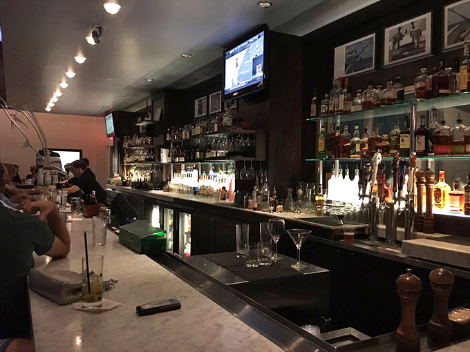 A bar stocked for serious cocktail crafting. The bottles gleam like treasure, promising libations worthy of your special occasion &ndash; or just Tuesday.