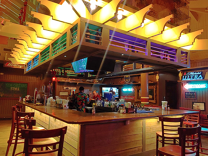 The bar area glows with promise, a beacon of tropical concoctions and cold beers where strangers become friends over stories of "the one that got away."