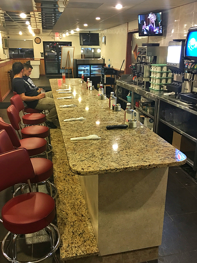 The counter where solo diners find community, caffeine flows freely, and the marble-look finish adds a touch of unexpected elegance to diner simplicity. 