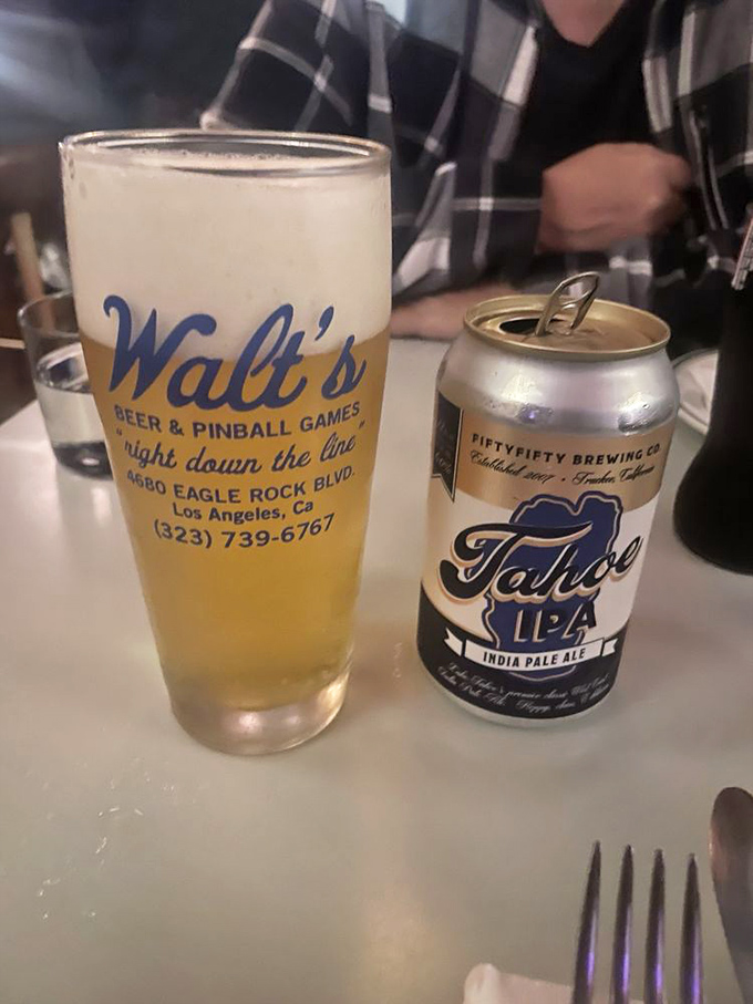 Beer served in a glass advertising Walt's, because great pizza deserves a proper sidekick. Tahoe IPA brings the mountain freshness.