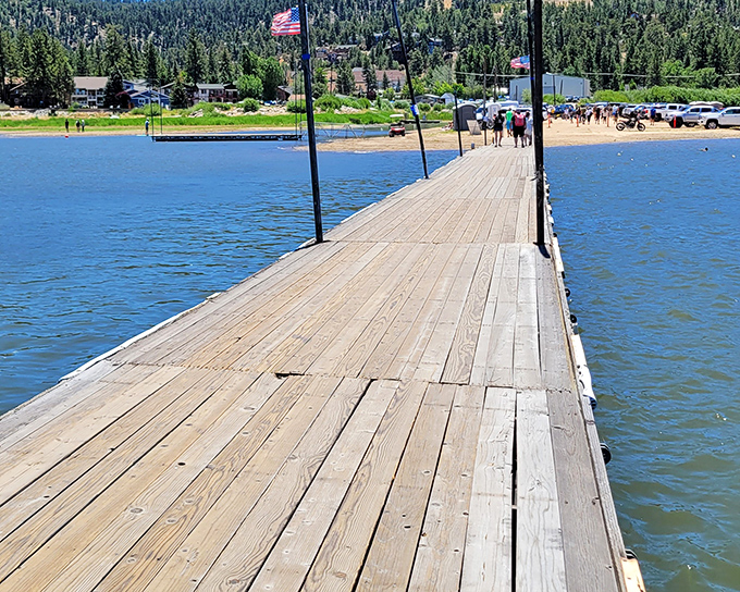 The wooden pier stretches toward mountain horizons like a runway for dreams, inviting visitors to walk just a little farther from everyday life.