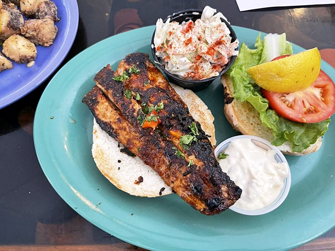Blackened mahi-mahi that wears its spices like a badge of honor, ready to be tucked into that waiting bun.