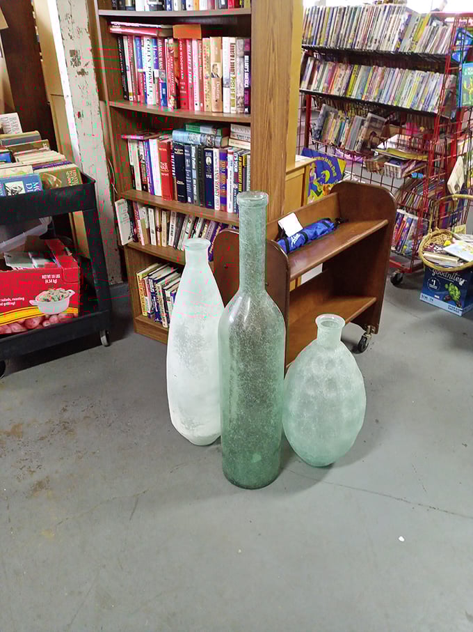 The book corner rivals small-town libraries, with frosted glass bottles standing guard over literary treasures like patient sentinels of stories.
