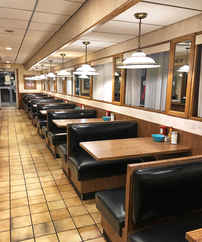 The classic diner booth&mdash;where sliding in feels like coming home and every meal tastes better against black vinyl and wood paneling.