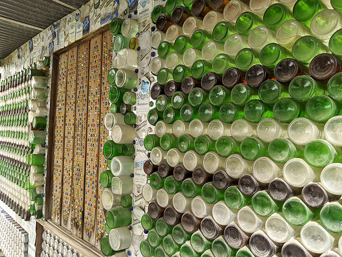 This sculptural element combines flattened cans with natural stone, proving that folk art can seamlessly blend the manufactured with the organic.