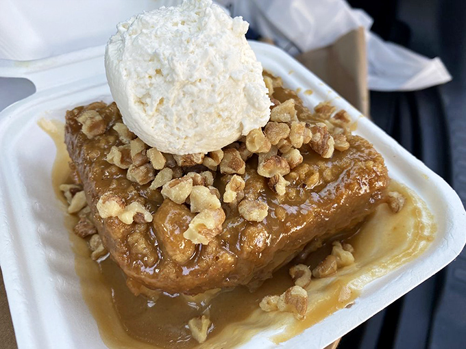 Bread pudding that makes you want to write thank-you notes to whoever invented dessert, topped with walnuts and a cloud of whipped cream.