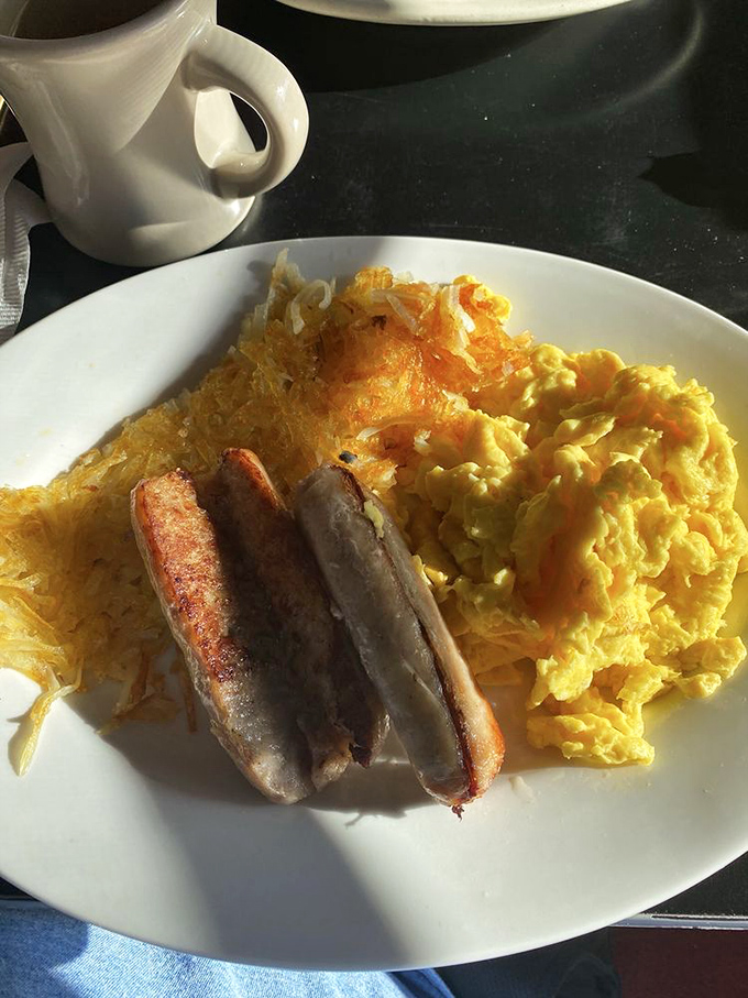 The breakfast trinity: perfectly scrambled eggs, crispy hash browns, and sausage links. Simple, unpretentious, and exactly what you want at 8 AM.