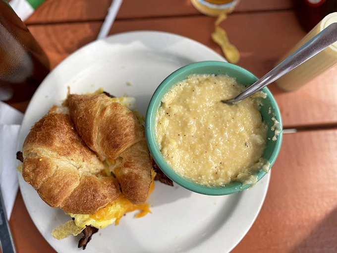 A breakfast sandwich and grits served in that turquoise bowl &ndash; Southern comfort that doesn't need to shout about its credentials.
