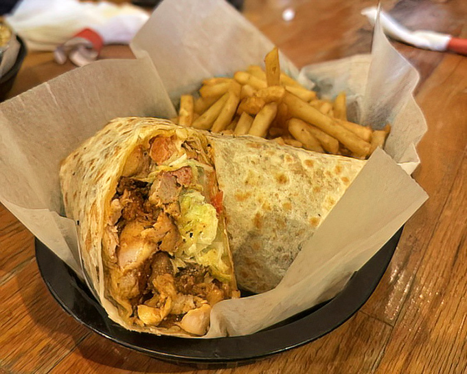 This wrap isn't just holding meat&mdash;it's cradling dreams. With those golden fries alongside, it's a portable feast worthy of celebration.