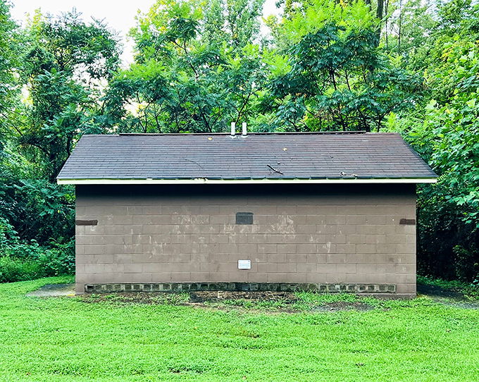 Not exactly five-star accommodations, but necessary nonetheless. This humble structure serves as a reminder that even in nature's cathedral, practical facilities matter.