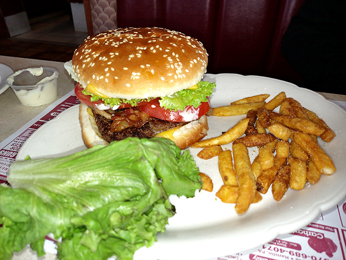 A classic diner burger with all the fixings and a golden pile of fries. Some food traditions don't need reinvention&mdash;just proper execution.