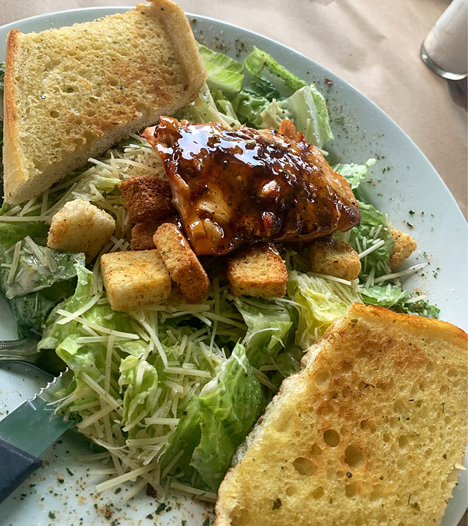 A Caesar salad transformed into a throne for glazed salmon&mdash;proof that healthy eating and indulgence can happily coexist.