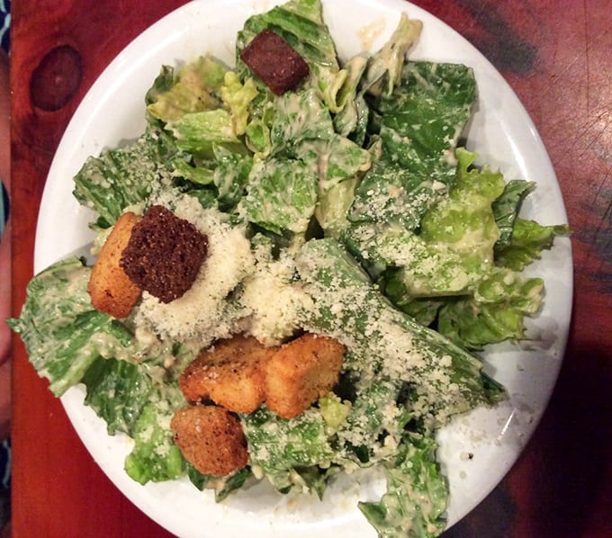 A Caesar salad that actually deserves respect&mdash;crisp romaine embraced by creamy dressing and crowned with crunchy croutons that weren't born in a box.